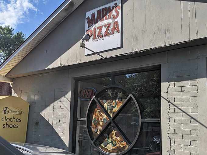 Mary's Pizza doesn't need fancy marketing&mdash;that slice-shaped window display says everything you need to know about their priorities. Simple, honest, delicious.