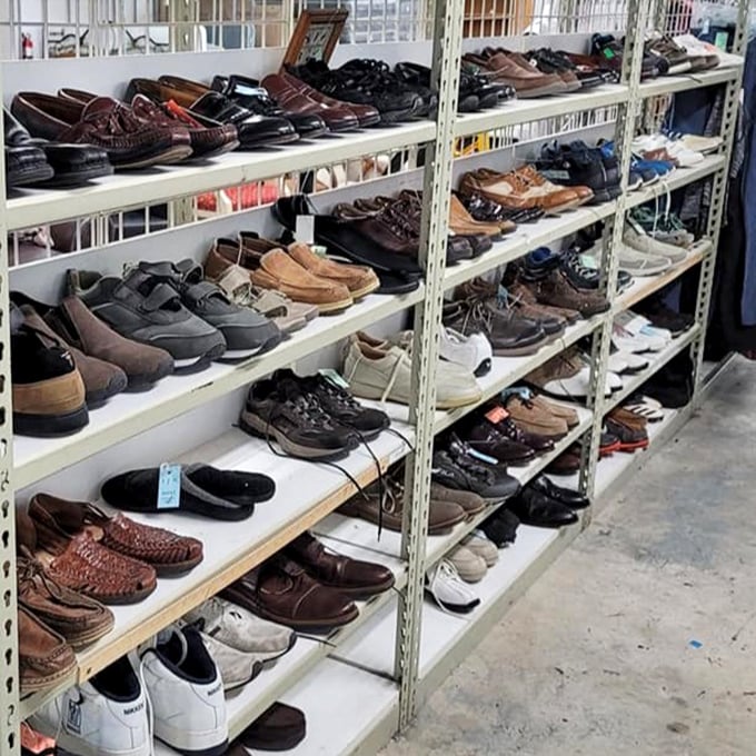 Men's shoes with stories to tell, arranged with surprising precision. Those barely-worn loafers might have only danced at one wedding before retiring here.