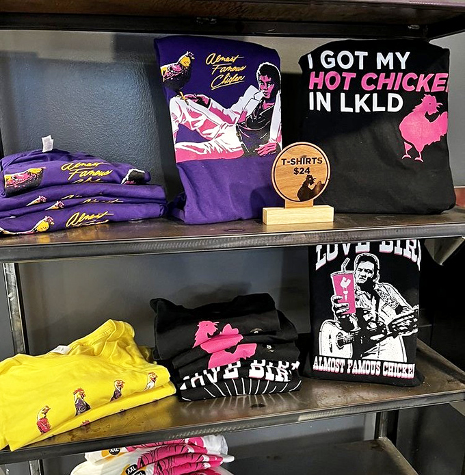 The merch wall proves LoveBird isn't just a restaurant but a lifestyle &ndash; with shirts declaring "I GOT MY HOT CHICKE IN LKLD" like badges of honor.