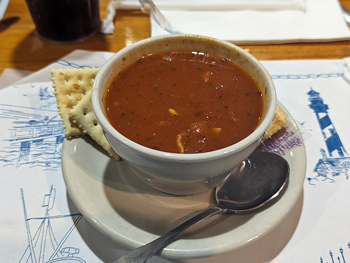 Minorcan clam chowder: St. Augustine's liquid legacy in a bowl. Tomato-based with a datil pepper kick that'll wake up taste buds you didn't know you had.