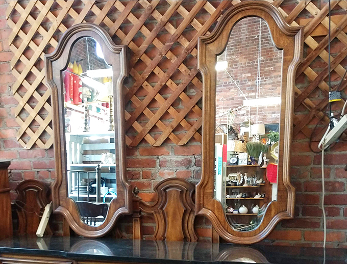Ornate mirrors that don't just reflect your image but seem to whisper, "You could look this good in every century." The lattice backdrop adds rustic charm to timeless elegance.