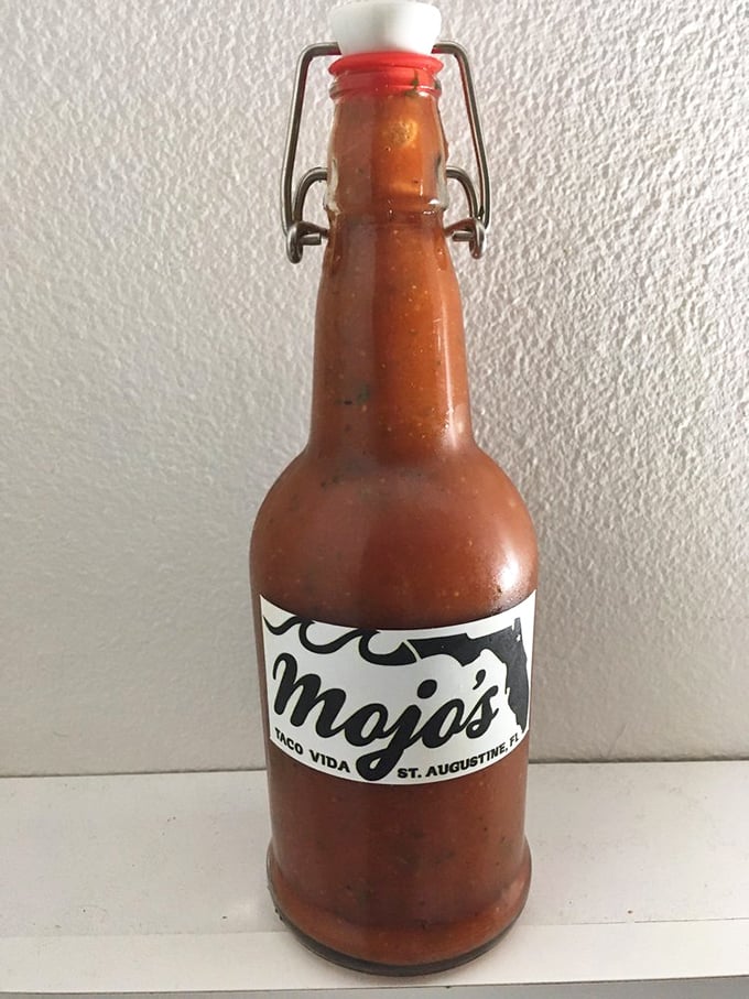 Liquid courage in a bottle &ndash; Mojo's house hot sauce promises to transform good food into an unforgettable experience. Proceed with delicious caution.
