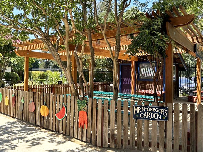 Mr. McGregor's Garden delights with its colorful fence decorations. Those vegetables look suspiciously safe from rabbit invasions—for now.