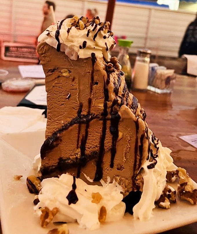 This mud pie doesn't just end a meal—it throws a party for your taste buds. The whipped cream and chocolate sauce are just showing off now.