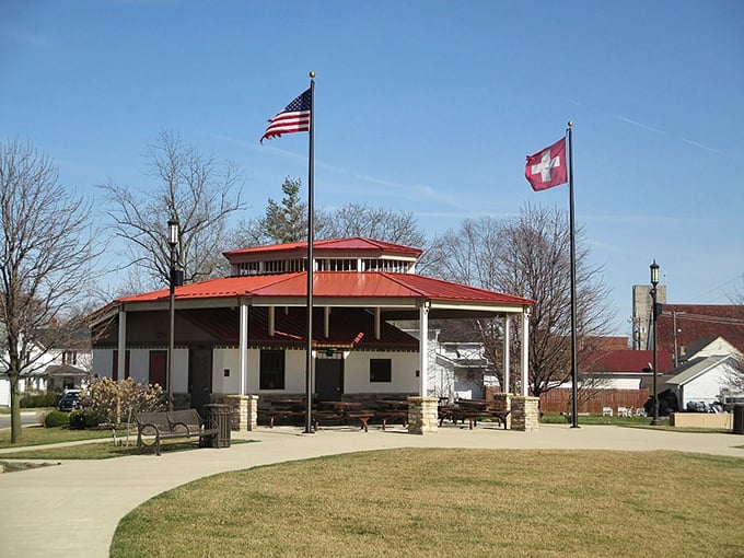 The Muensterberg Pavilion stands ready for community gatherings, with both American and Swiss flags proudly waving in the Indiana breeze.