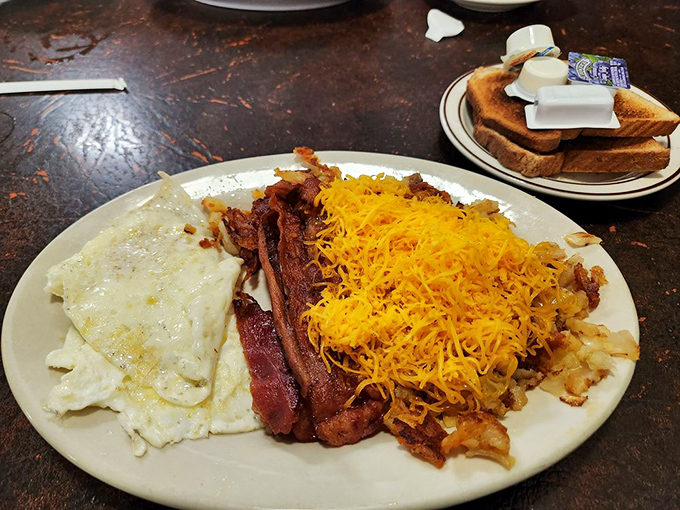 The breakfast of champions doesn't need avocado or a fancy presentation&mdash;just perfectly cooked eggs, crispy bacon, and hash browns with that essential golden crust.