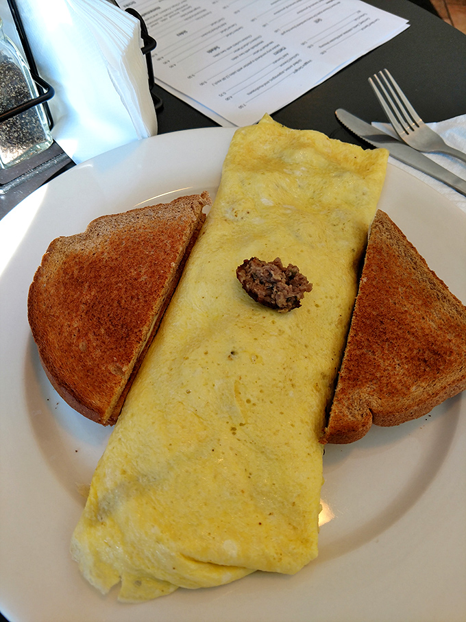 This omelet doesn't just sit on the plate &ndash; it lounges there confidently, knowing it's about to make your morning infinitely better.