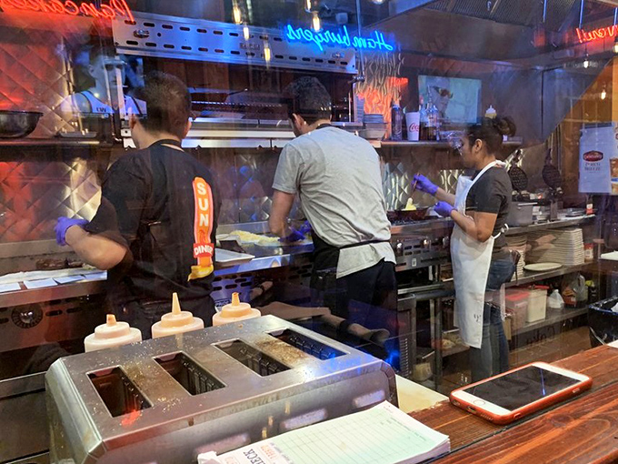 The open kitchen reveals the breakfast ballet&mdash;skilled hands flipping, stirring, and plating your morning masterpiece with practiced precision.