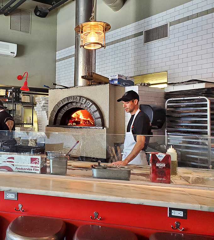 The heart of the operation: a wood-fired oven blazing at 600 degrees, where pizza dreams come true before your eyes.