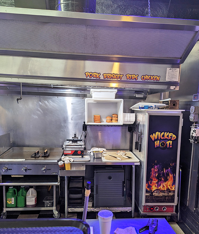 Where the magic happens. That smoker labeled "WICKED HOT" isn't just equipment&mdash;it's the beating heart of the whole operation.
