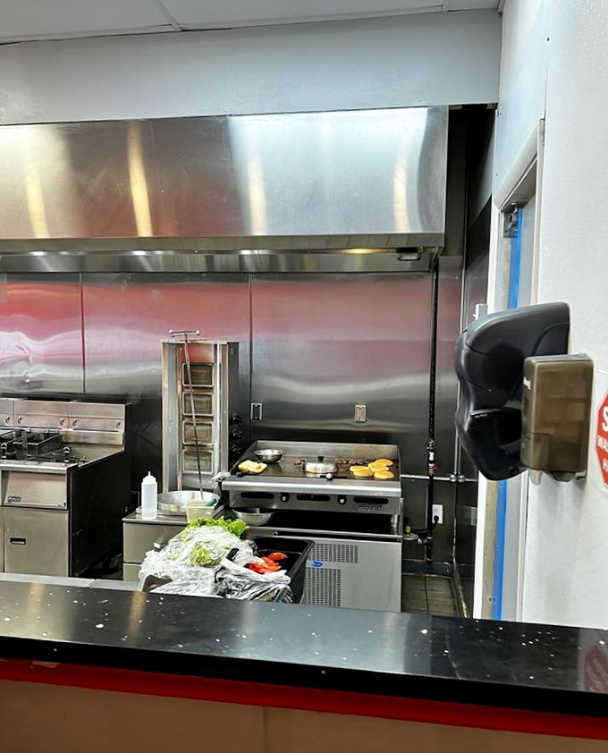 Where the magic happens&mdash;spotless stainless steel and fresh ingredients waiting to become memories. Kitchen choreography at its finest.