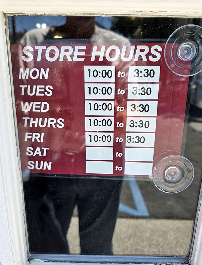 Operating hours posted with no-nonsense clarity—a weekday-only schedule that makes each visit feel like catching a limited engagement performance.