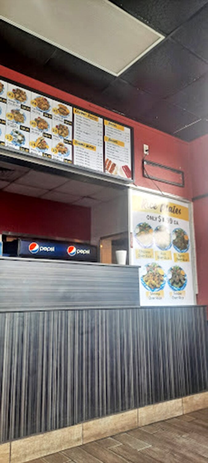 Behind the counter, the command center operates with military precision, turning raw seafood into golden happiness.