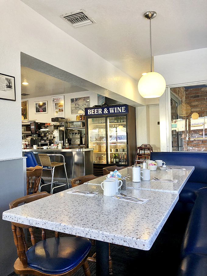 The perfect corner table awaits, with coffee cups standing ready for refills and the promise of comfort food just moments away.