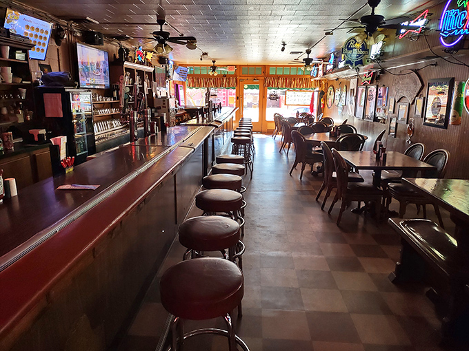 A long view down the bar shows the tavern in quiet anticipation before the lunch rush. Morning light streams through windows that have seen it all.