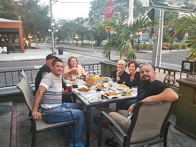 Outdoor dining with a view of Tampa street life&mdash;where Irish hospitality meets Florida's perfect weather for an unbeatable combination.