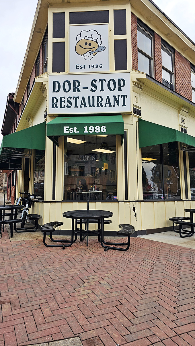 The iconic corner entrance with its cartoon pancake mascot practically winks at passersby, promising delicious secrets inside.
