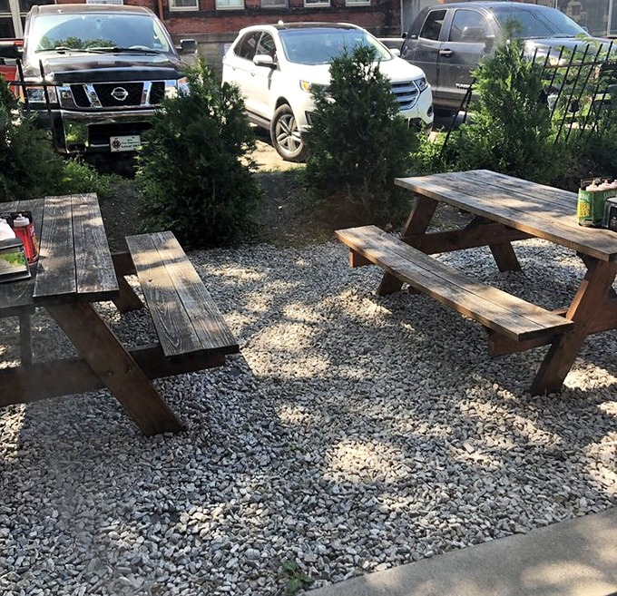 Rustic picnic tables where summer memories are made. Some of life's best conversations happen over shared plates of brisket.