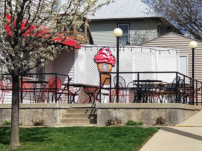 Spring blossoms, red tables, and an ice cream cone sign&mdash;this outdoor seating area practically screams "Summer in the Midwest is here!"