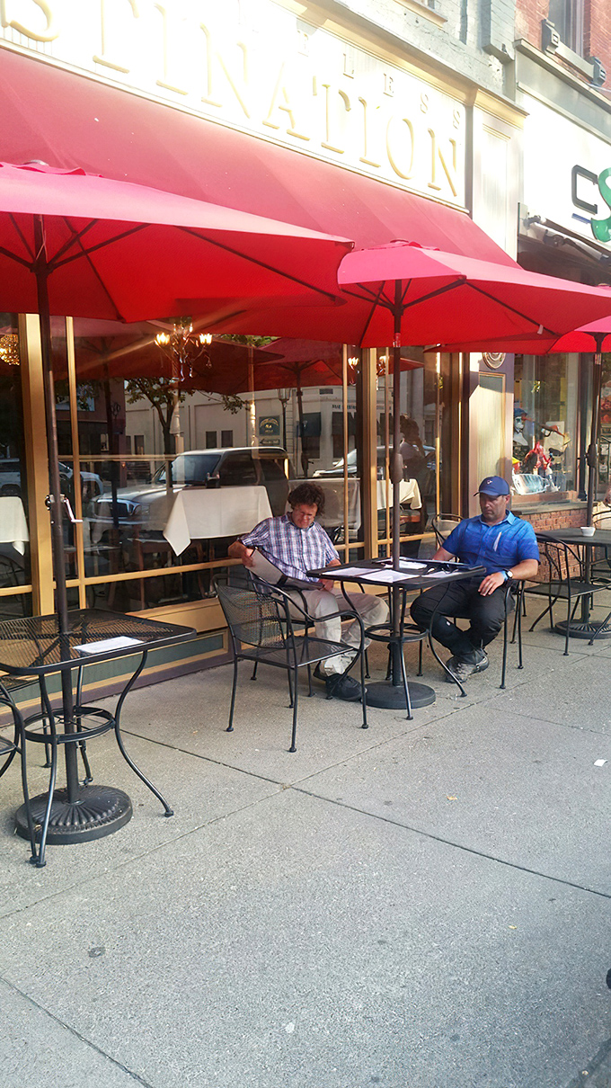 Sidewalk dining under red umbrellas transforms any meal into a European-style adventure right in Pennsylvania.