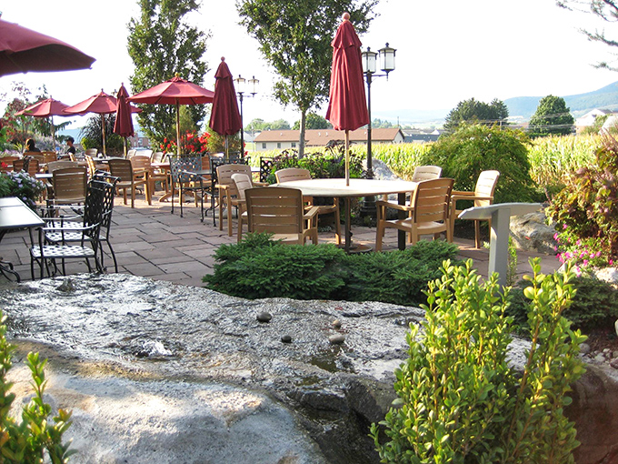 Outdoor seating with mountain views and a water feature&mdash;because good food deserves good scenery. Nature's dining room awaits.