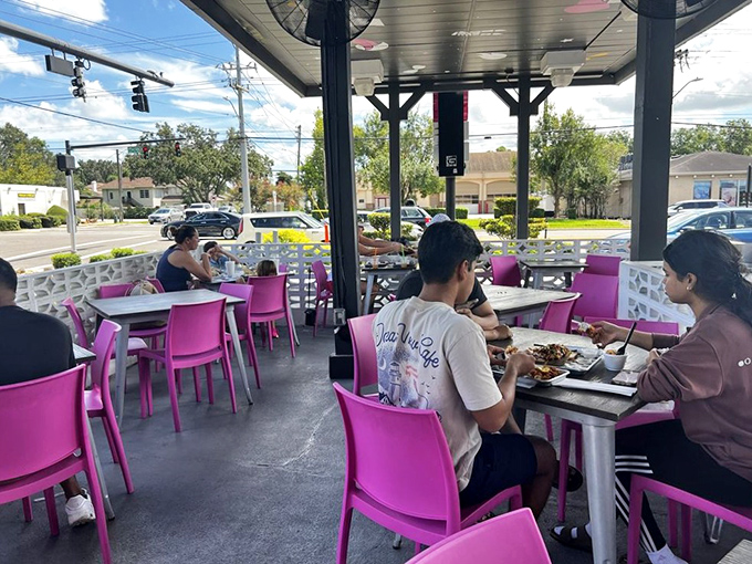 Al fresco dining with a side of people-watching. Those pink chairs look even better under Florida's blue skies.