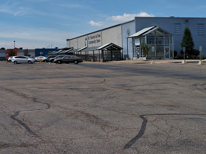 Where bargain hunters park their chariots. The spacious lot welcomes shoppers ready to fill their trunks with second-hand gold.