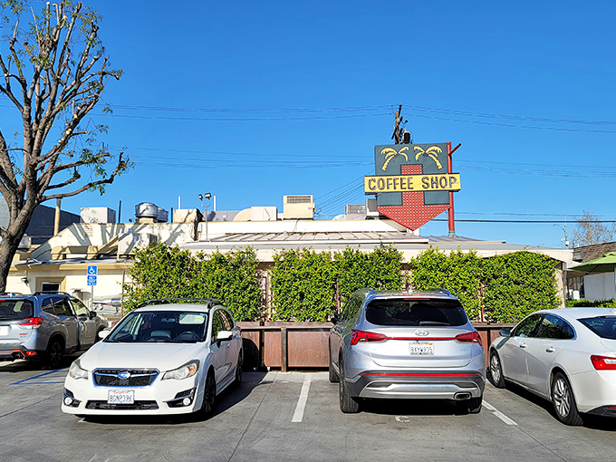 Even the parking lot has that classic diner charm, with the iconic "Coffee Shop" sign standing tall like a beacon for hungry travelers.