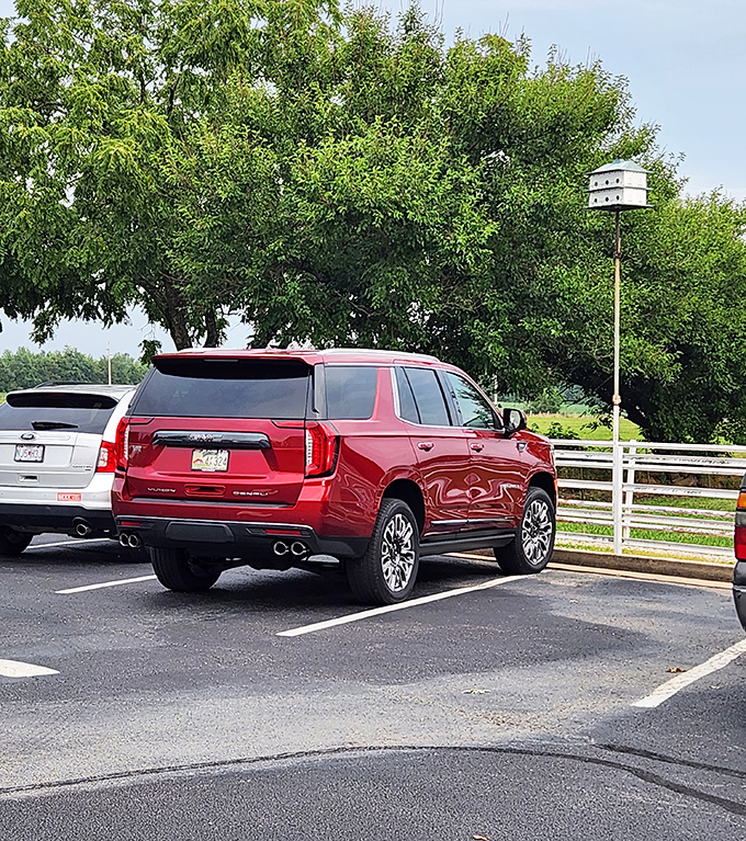 The parking lot view hints at rural tranquility. Your vehicle might be the only one that isn't a luxury SUV or a vintage convertible.