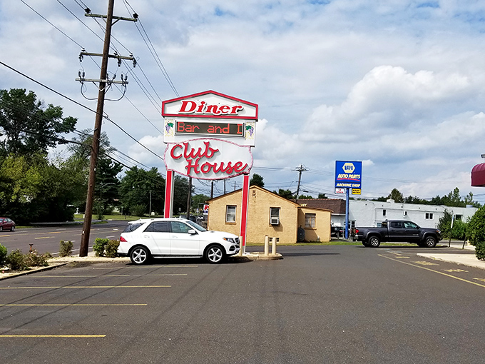 The vintage sign stands tall against the suburban landscape, a neon beacon guiding hungry travelers to breakfast bliss.