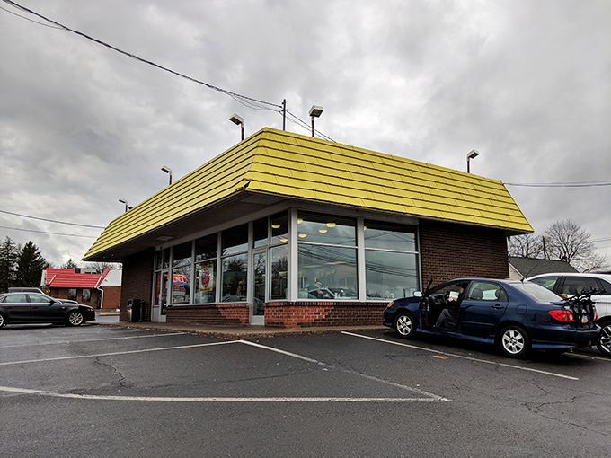 Even on a cloudy day, that yellow roof shines like a sugary lighthouse guiding hungry travelers to safe harbor.