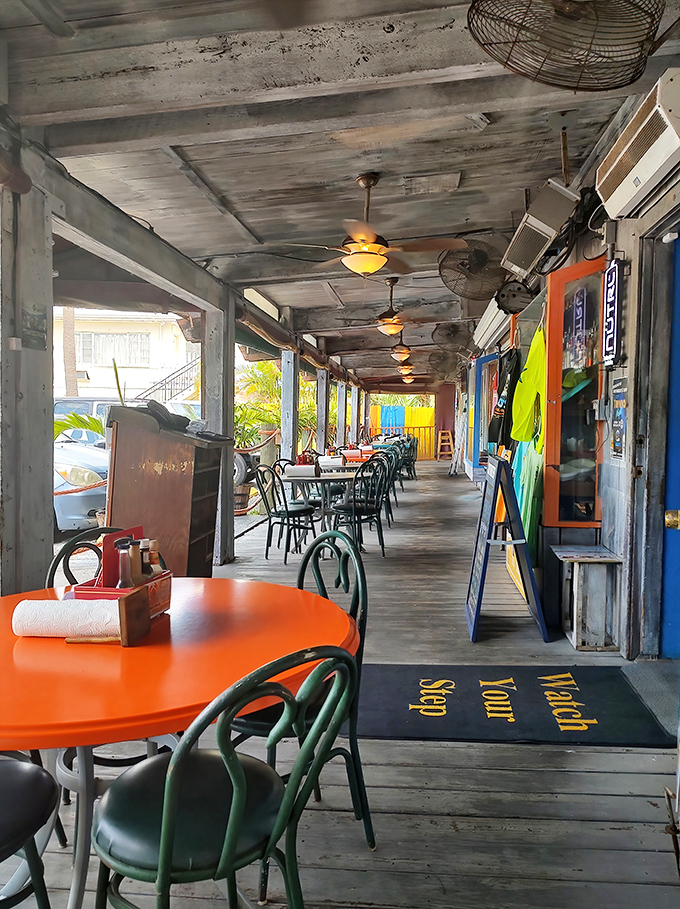 A weathered wooden porch that's witnessed thousands of sunset conversations and "just one more" promises that nobody really means.