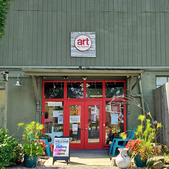 Peninsula Art Academy's vibrant red doors swing open to creativity, welcoming artists and appreciators alike into a world of color and imagination.