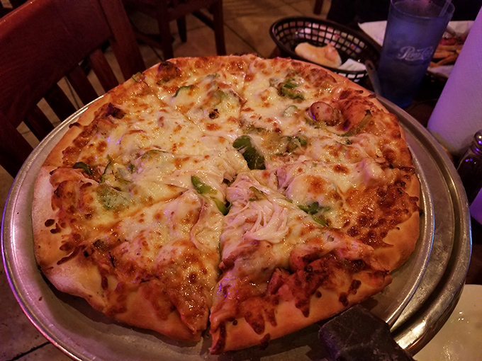 This isn't just pizza&mdash;it's scratch-made evidence that Ziffle's refuses to be pigeonholed as "just a BBQ joint." Those bubbling cheese islands tell the whole story.