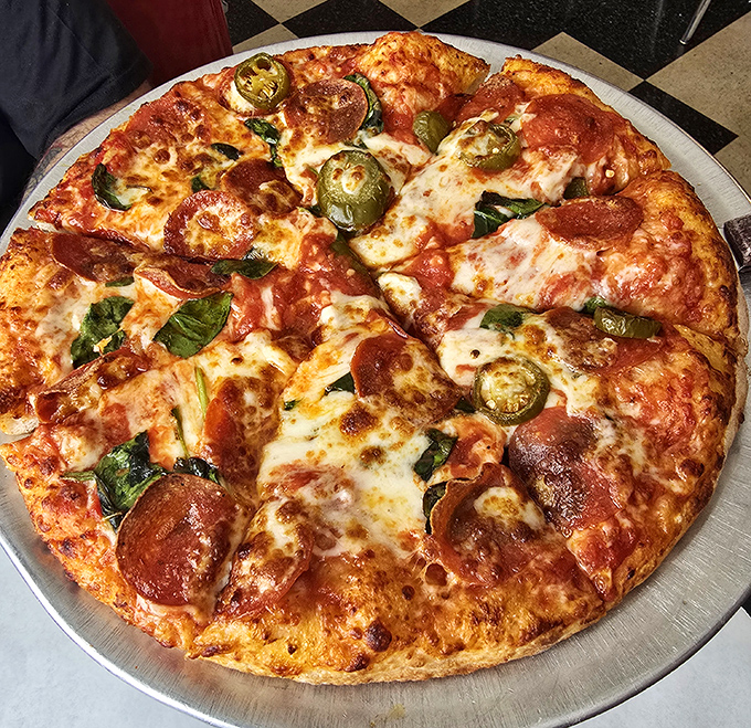Pizza that makes Italian grandmothers nod in approval. The perfect ratio of cheese to sauce, with jalapeños and pepperoni playing the starring roles.