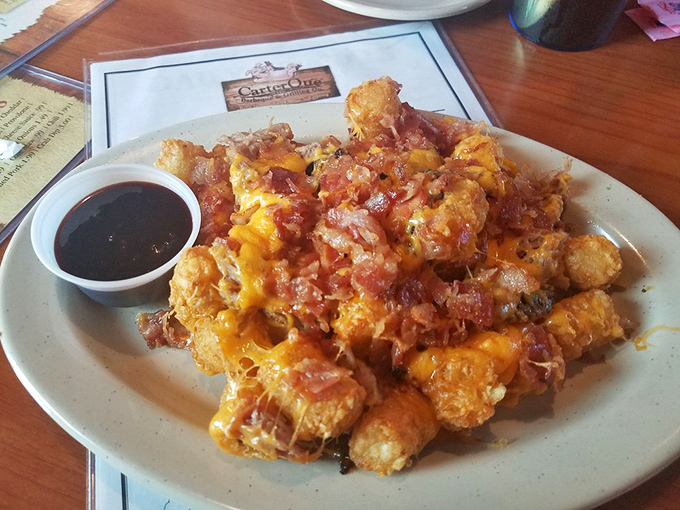 Porky Tots &ndash; where tater tots meet barbecue in a glorious collision of comfort foods topped with melty cheese and bacon.