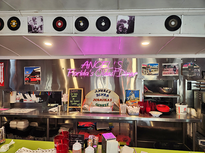 That neon "Angel's" sign glowing against stainless steel is the North Star of comfort food, guiding hungry souls to burger salvation since 1932.