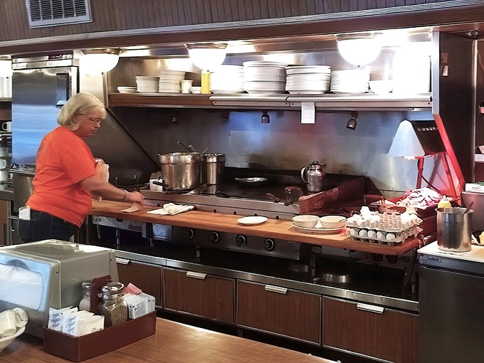 Decades of experience at work. Every movement efficient, every dish consistent, creating the reliability that turns first-timers into lifers.