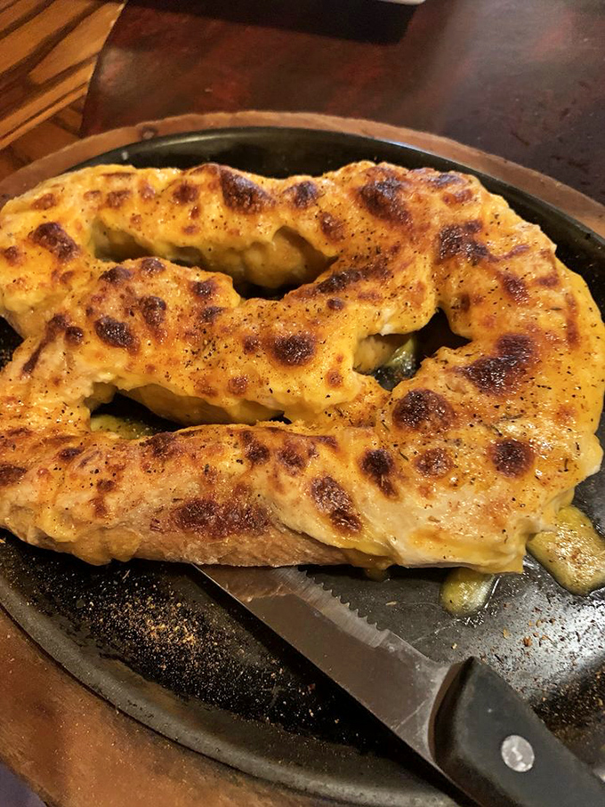 This pretzel isn't messing around&mdash;golden, twisted perfection topped with cheese that's been melted with what can only be described as profound respect.