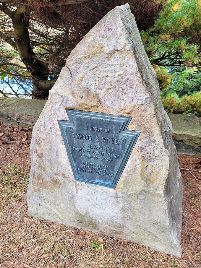 A stone tribute to the man who saved this slice of Pennsylvania paradise. Some heroes wear ranger hats, not capes.