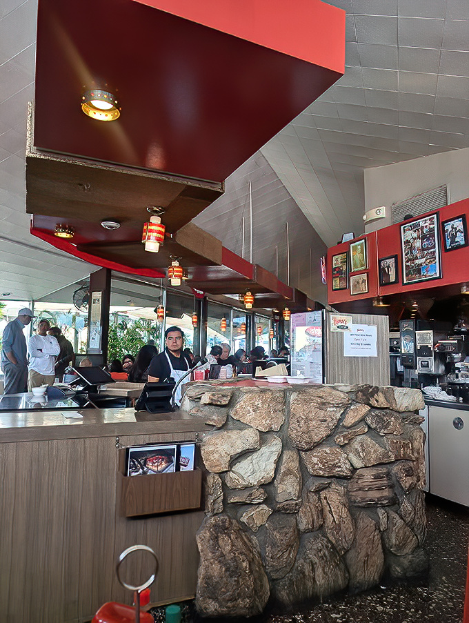 The reception area's stone wall construction has witnessed more first dates, family reunions, and business deals than most marriage counselors.
