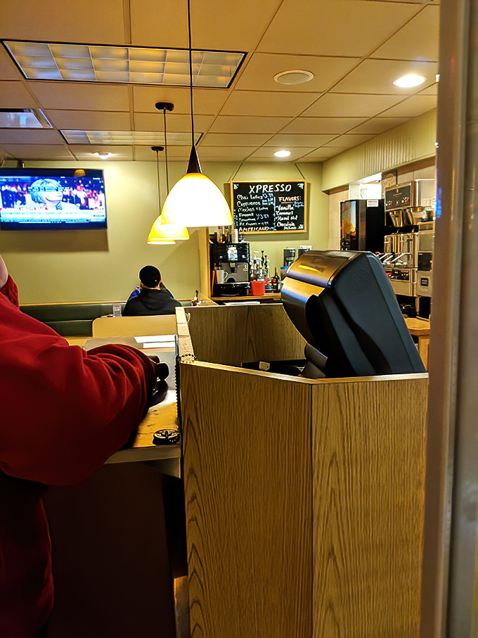 The heart of the operation&mdash;where orders fly and breakfast dreams materialize. That pendant lighting casts a golden glow on morning possibilities.