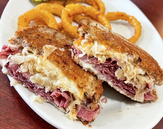 The Reuben that launched a thousand cravings, with sauerkraut and corned beef in perfect harmony. Those onion rings aren't just sides&mdash;they're supporting actors deserving their own award.