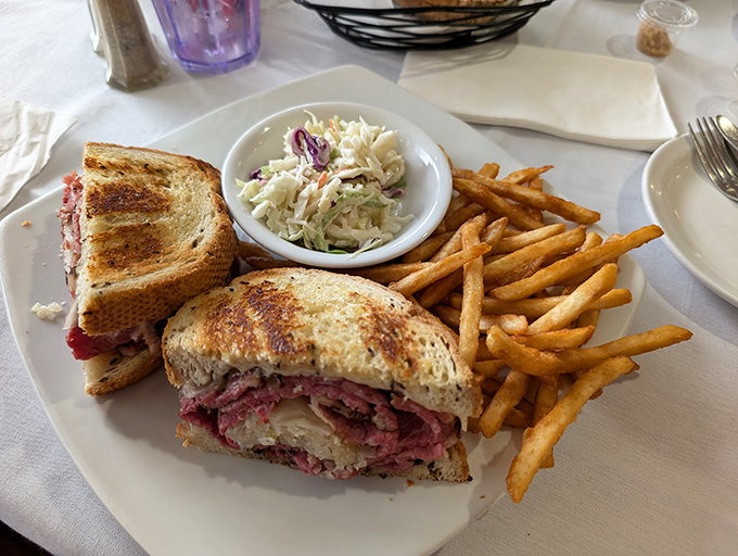 The legendary Reuben sandwich that somehow manages to balance every flavor while maintaining structural integrity throughout each bite.