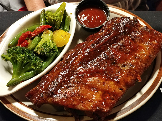 These ribs don't just fall off the bone&mdash;they practically leap onto your fork, trailing a wake of tangy sauce and smoky perfection.
