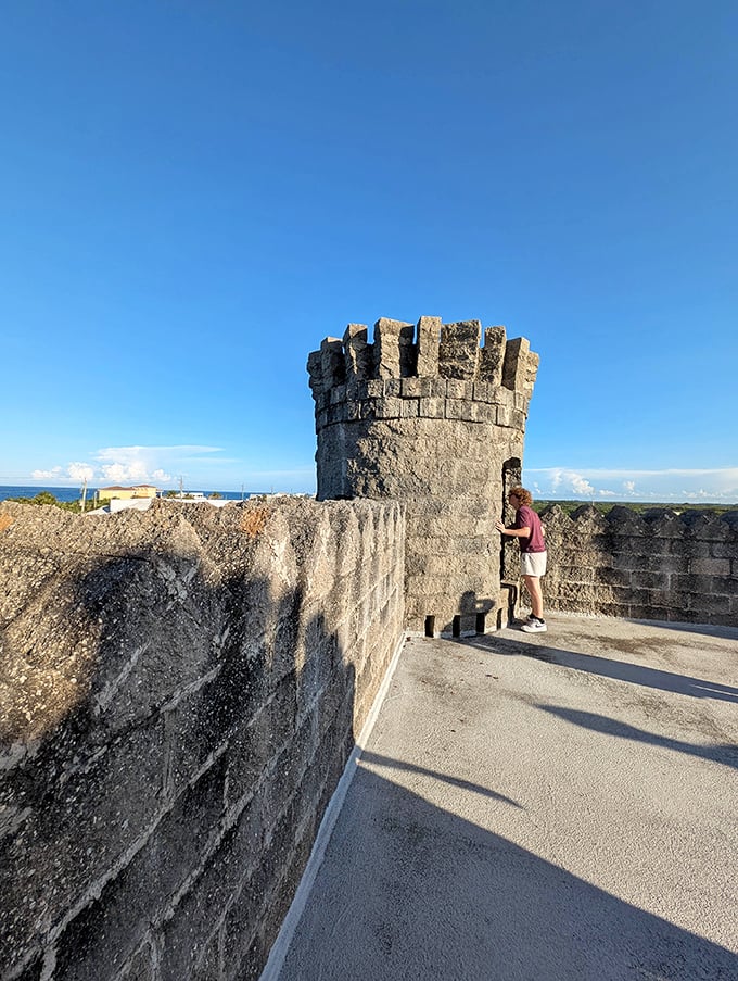 The castle's upper walkway invites exploration, though medieval builders never had to worry about visitors stopping for selfies.