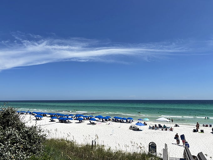 That moment when you crest the dune and the Gulf of Mexico stretches before you like nature's welcome mat. Blue umbrellas optional.