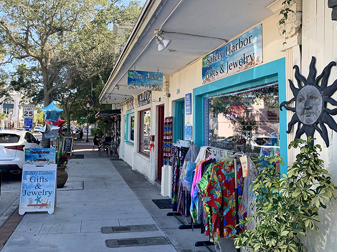 Colorful merchandise spills onto the sidewalk outside Safety Harbor Gifts & Jewelry. Window shopping here becomes an adventure in coastal aesthetics.