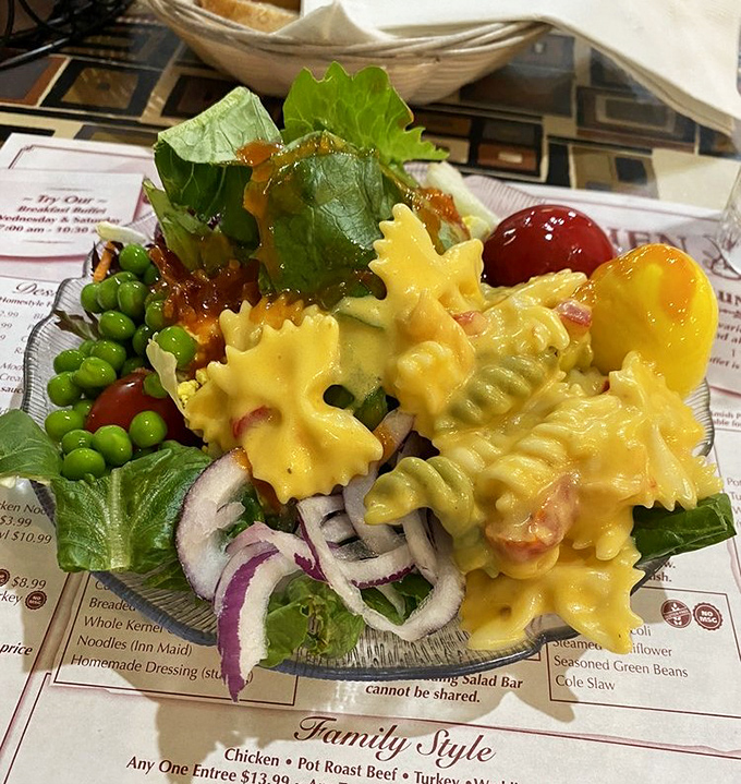 A pasta salad that dresses for the occasion, bringing vegetables along for the ride in a colorful, delicious entourage.