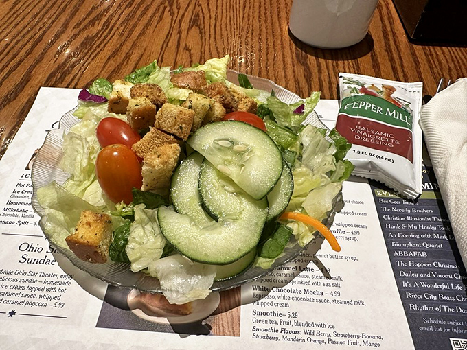 A garden-fresh salad that's clearly just a polite formality before the pie course. Those homemade croutons are the real MVPs.